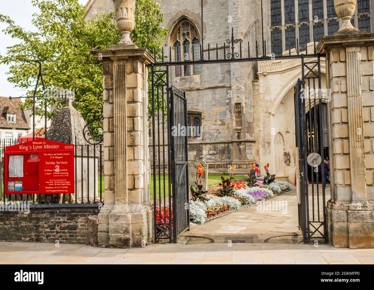 The stunning entrance with high pillars and metal gates to the church ...