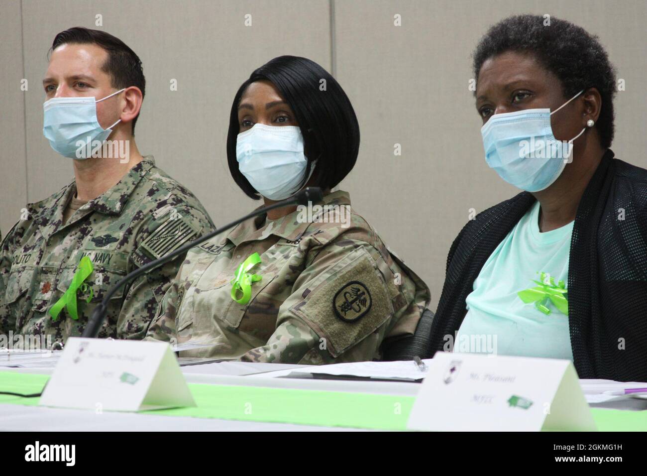 From left, Navy Lt. Cmdr. Michael Polito, a child and adolescent ...