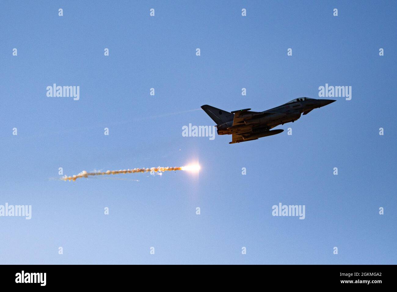 A Eurofighter Typhoon assigned to the Italian air force drops flares ...