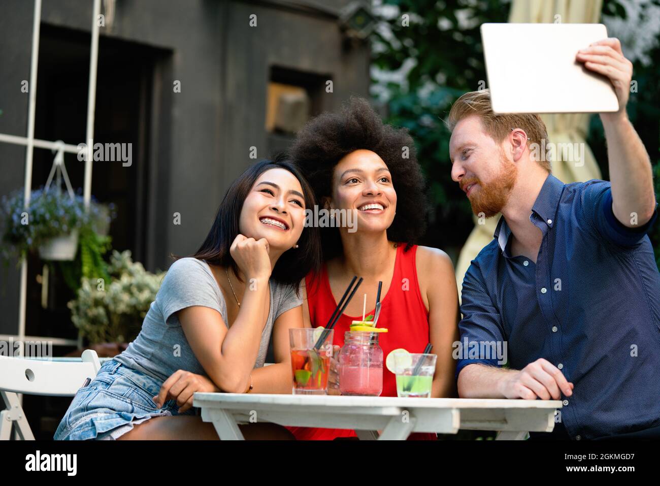Group of friends having fun together. People talking laughing and ...