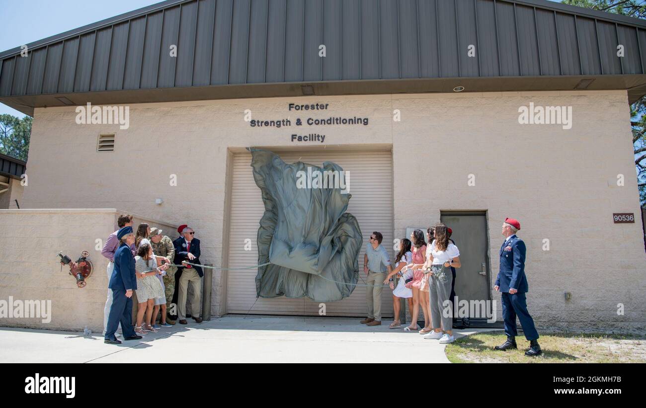Family members of U.S. Air Force Senior Airman Mark Forester unveil the ...