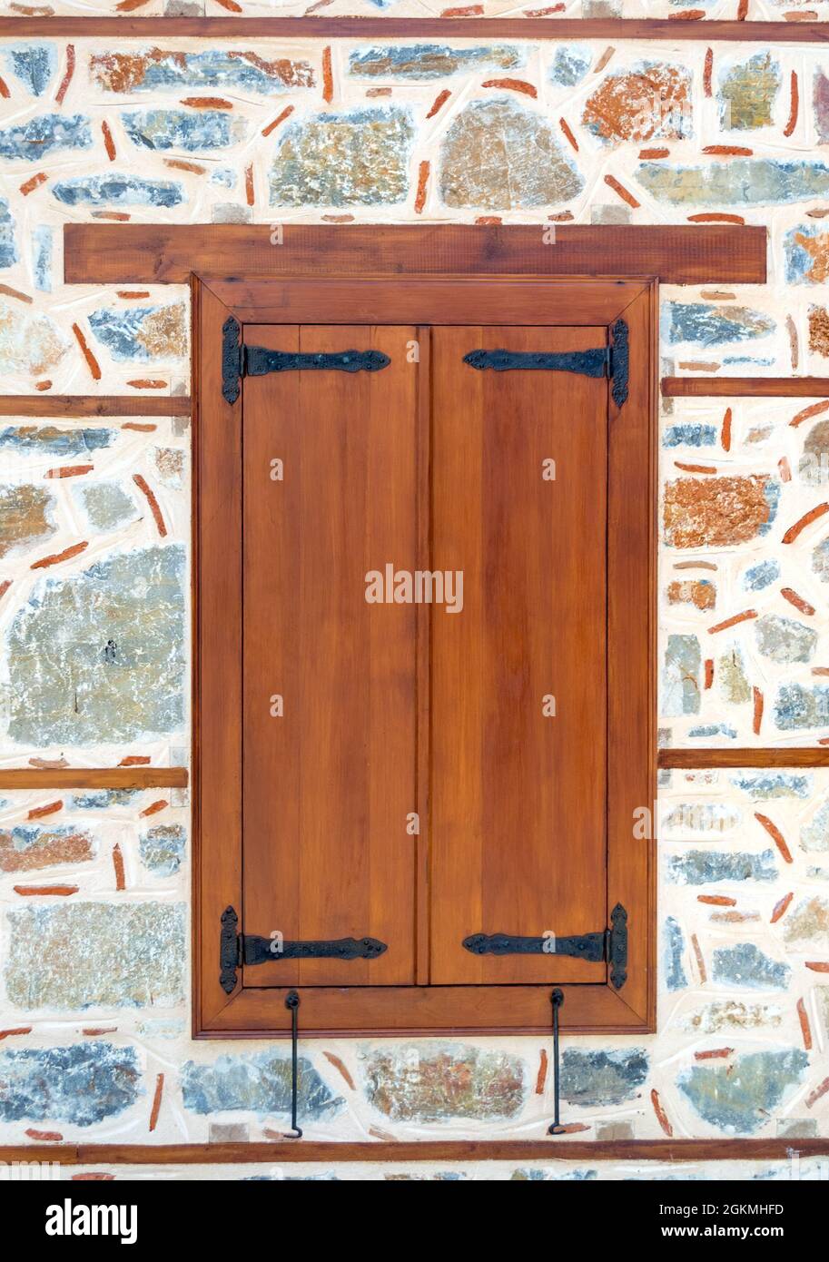 Wooden window shutters closed onbeautiful stone wall Stock Photo - Alamy