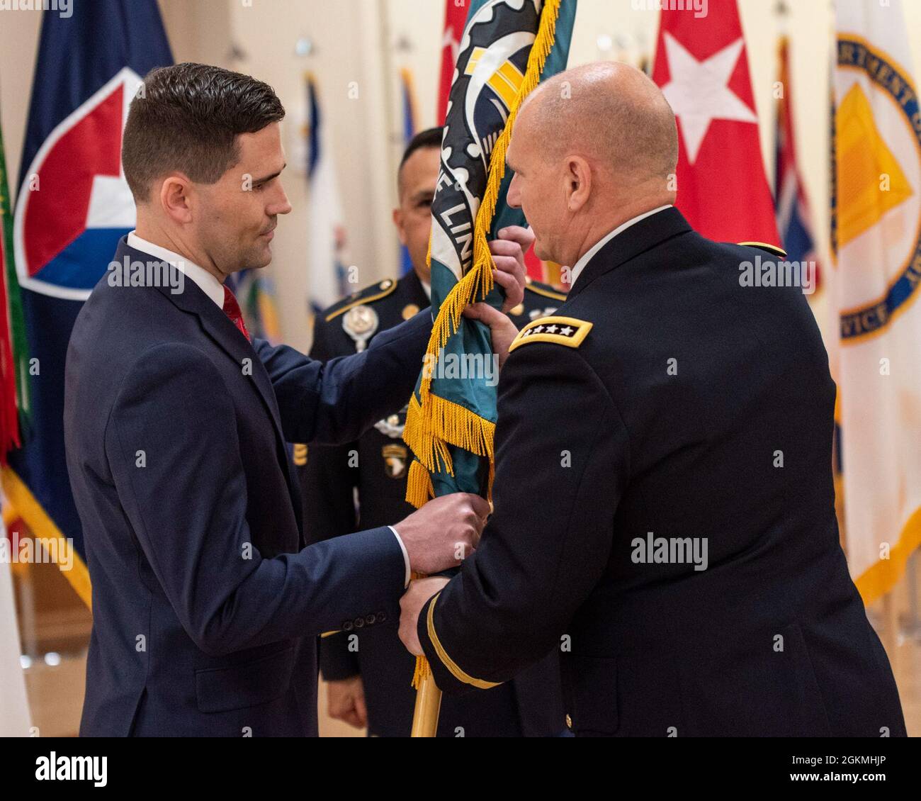 Matthew Sannito, ASC deputy to the commanding general, receives the ASC ...