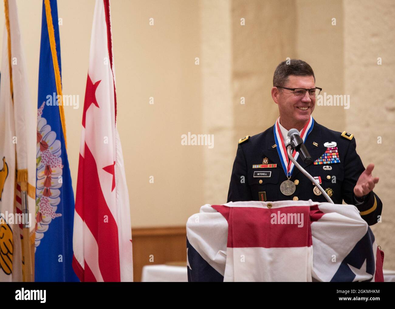 Maj. Gen. Daniel Mitchell shares a laugh as he speaks during his ...