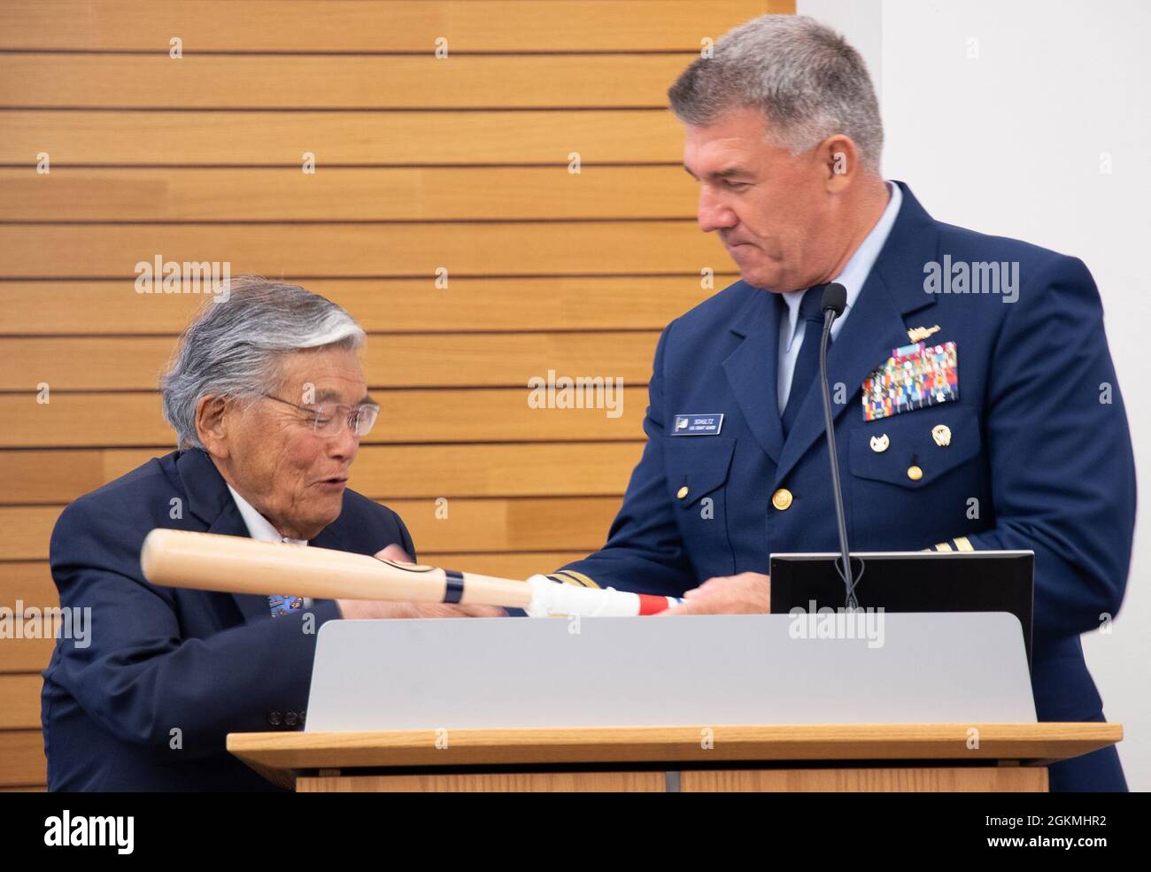 Adm. Karl Schultz, Commandant, United States Coast Guard, presents a ...