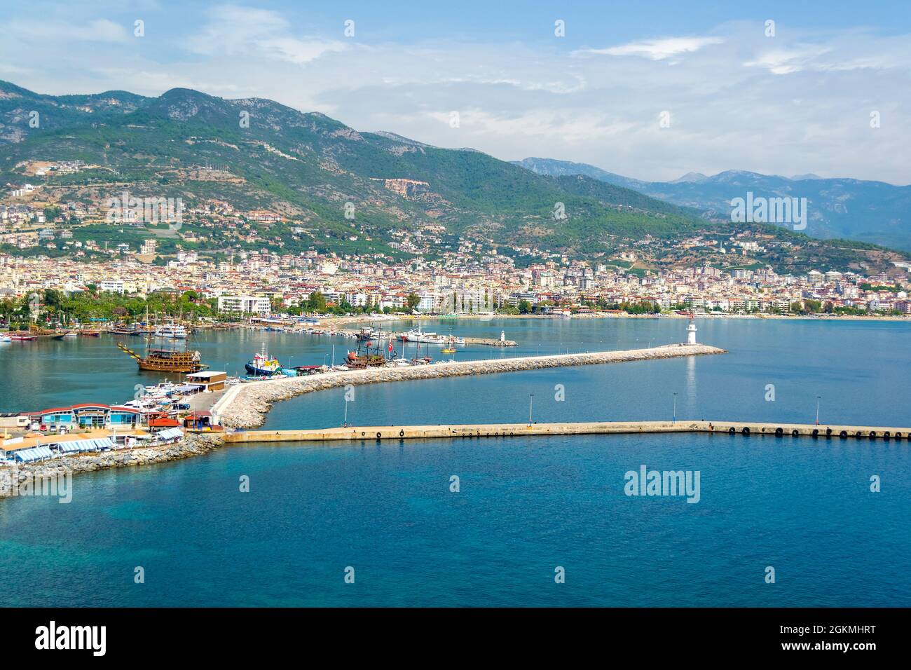 Cruise ships in Alanya harbor sea port and lighthouse, Turkey Stock ...