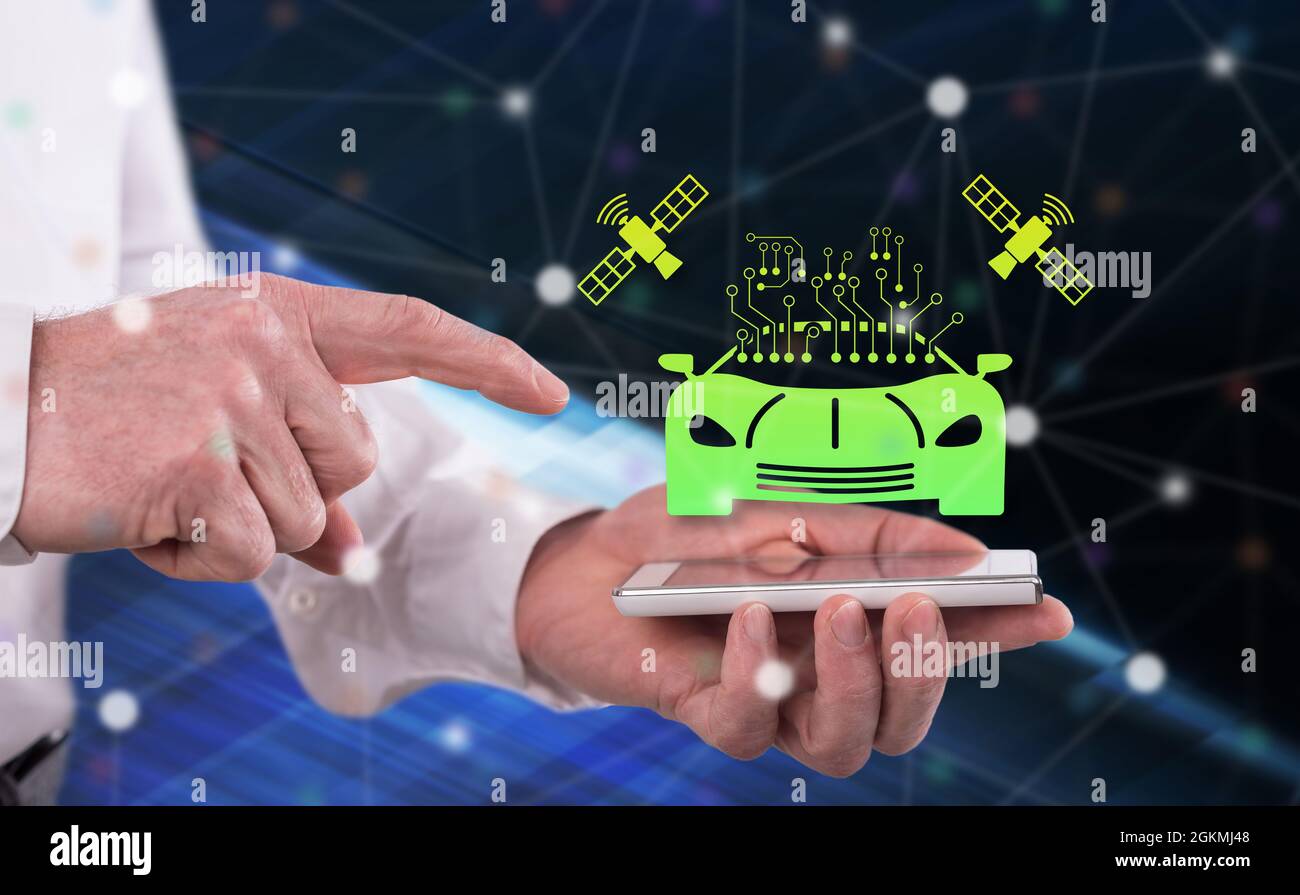 Autonomous car concept above a smartphone held by a man Stock Photo - Alamy