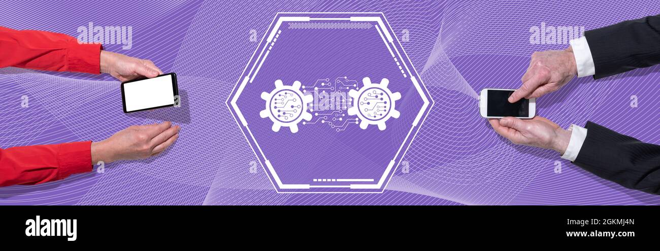 Top view of hands using mobile phone with symbol of automation concept ...