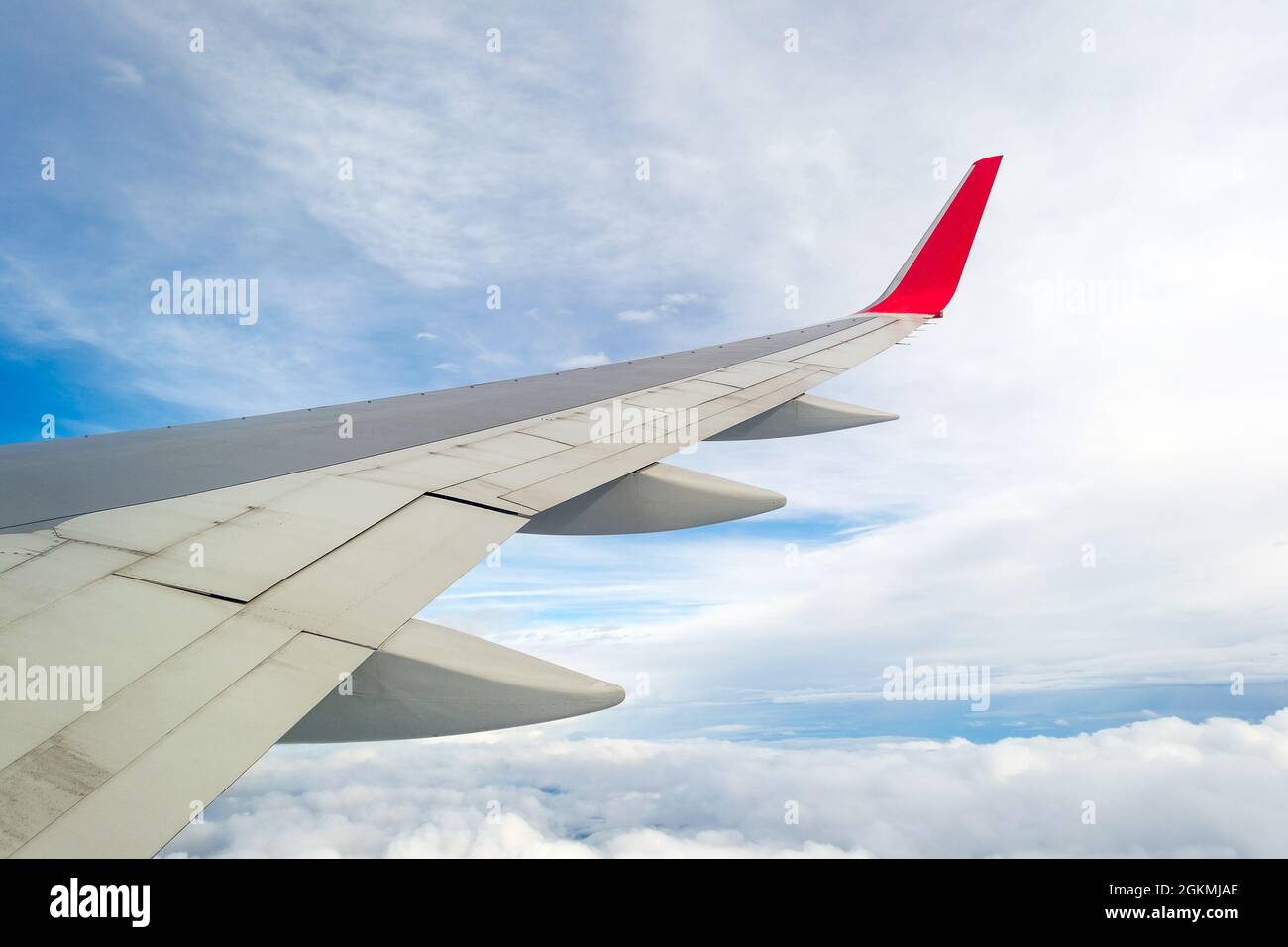 View from window seat of an airplane, wing, blue sky and clouds Stock ...