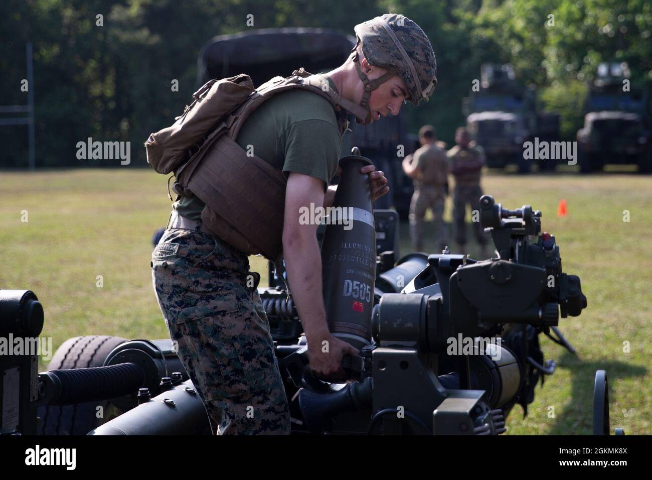 U.S. Marine Corps Lance Cpl. John G. Eaton IV, an assistant gunner with ...