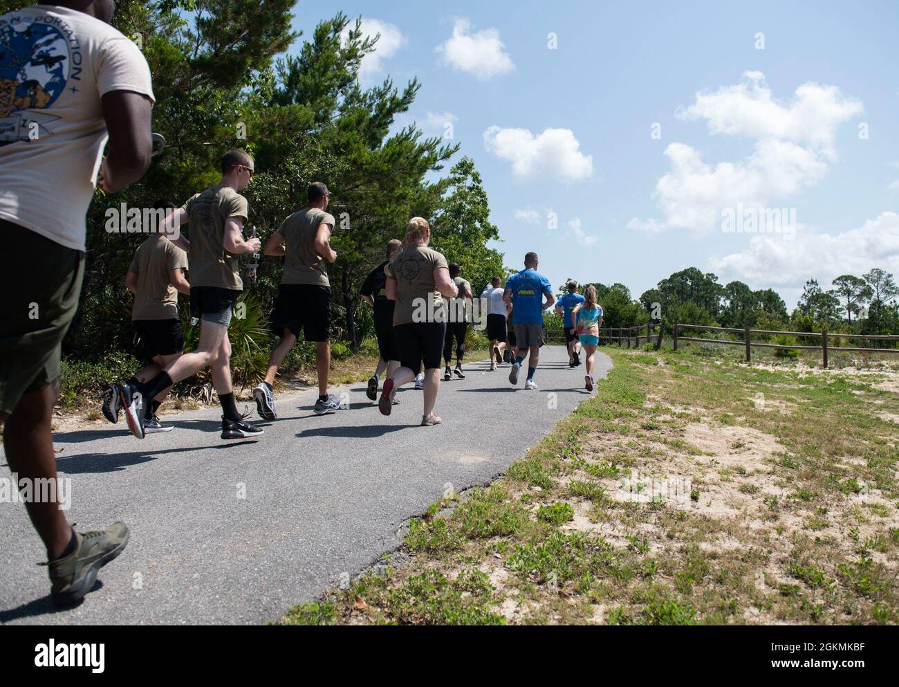 U.S. Air Force Airmen run along a path during the annual Port Dawg ...