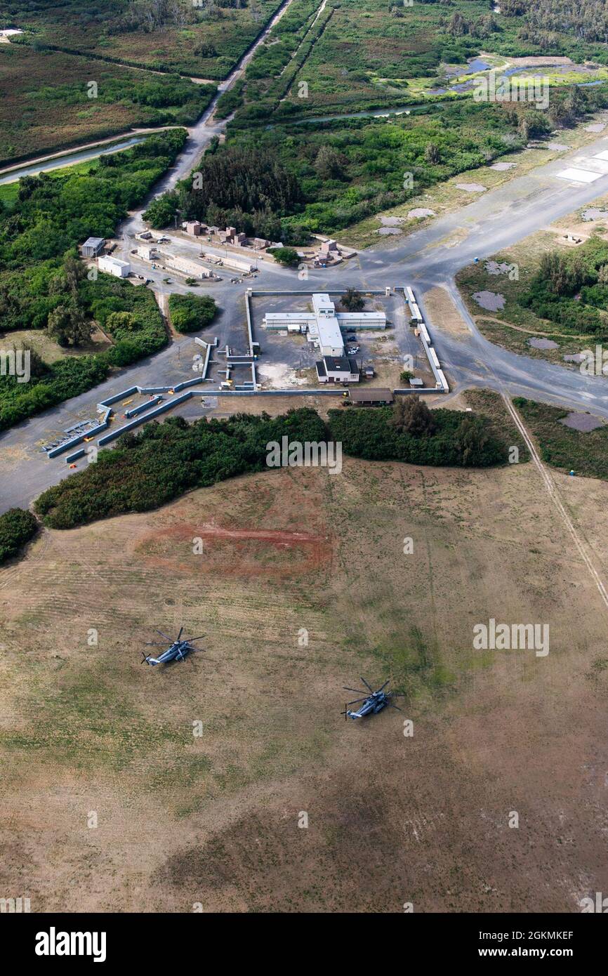 Two CH-53E Super Stallions attached to Marine Heavy Helicopter Squadron ...