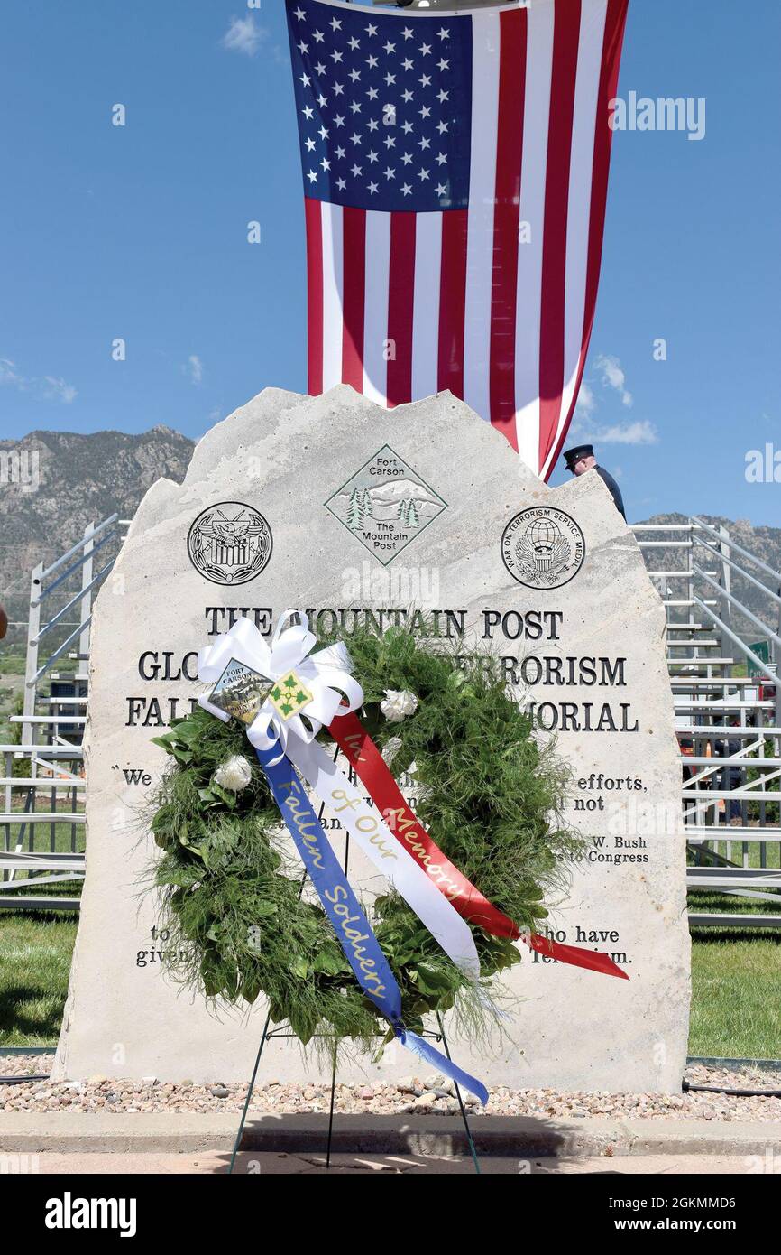 FORT CARSON, Colo. — A memorial wreath with two carnations symbolizing ...