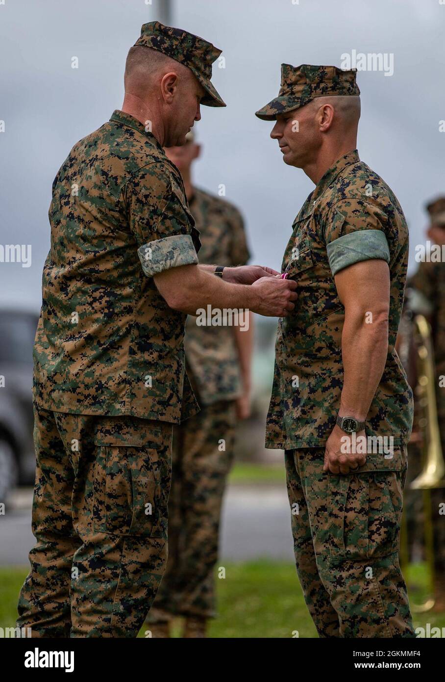 U.S. Marine Corps Lt. Col. Nicholas Waldron, right, is awarded a ...