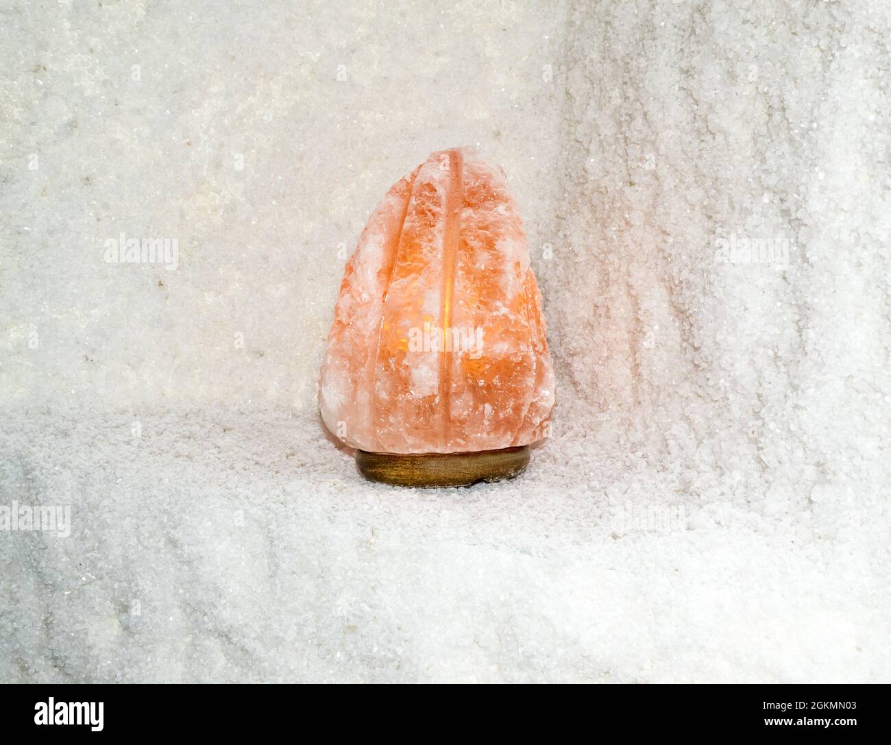 Himalayan orange salt lamp on salty shelf Stock Photo - Alamy