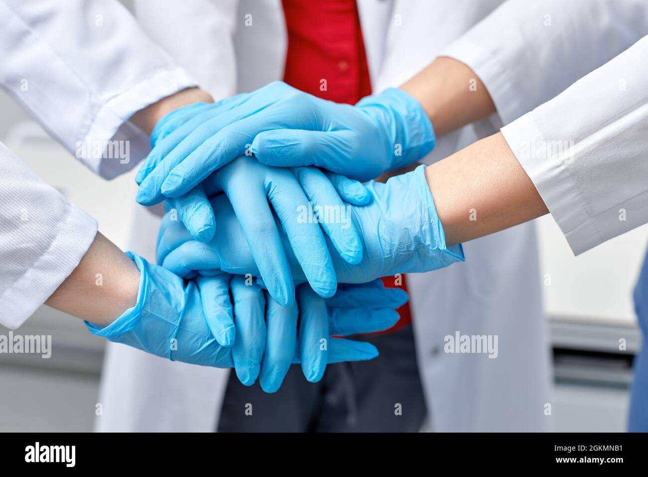 Hands in blue gloves covid, concept - creative team with hands on top ...