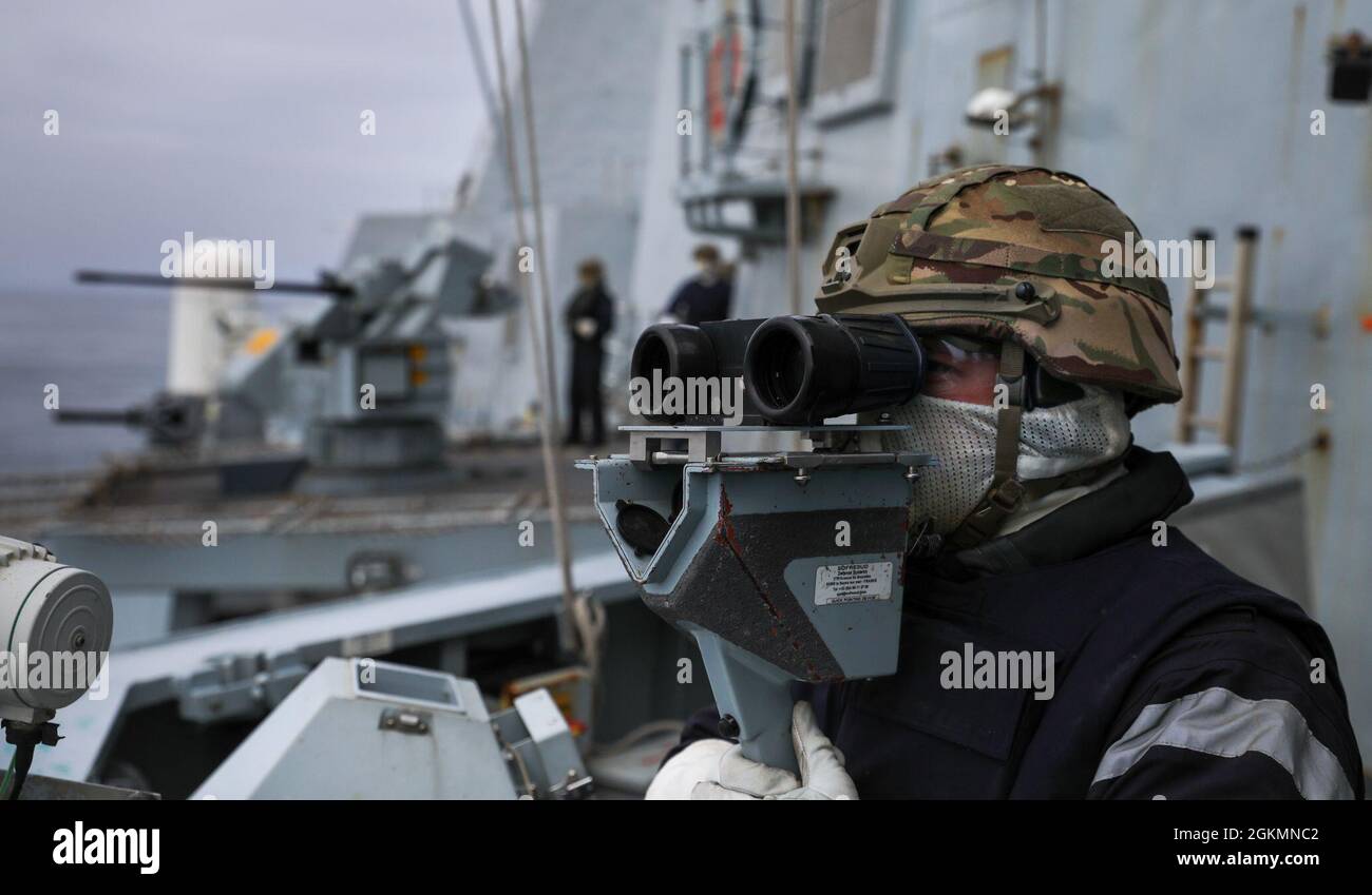 Royal Navy Type 45 destroyer HMS Dragon fires a 4.5 inch (114mm) gun ...