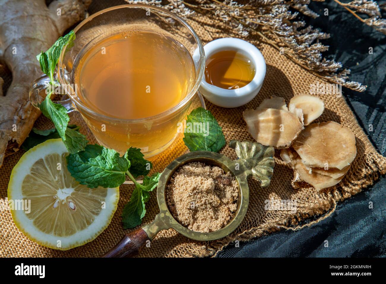 Hot Ginger juice with lemon and mint, root and slices of ginger Served ...