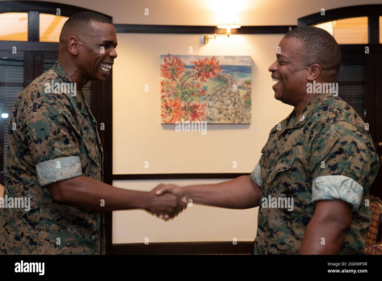U.S. Marine Corps Master Sgt. Keith Dempsey (ret.) is congratulated by ...