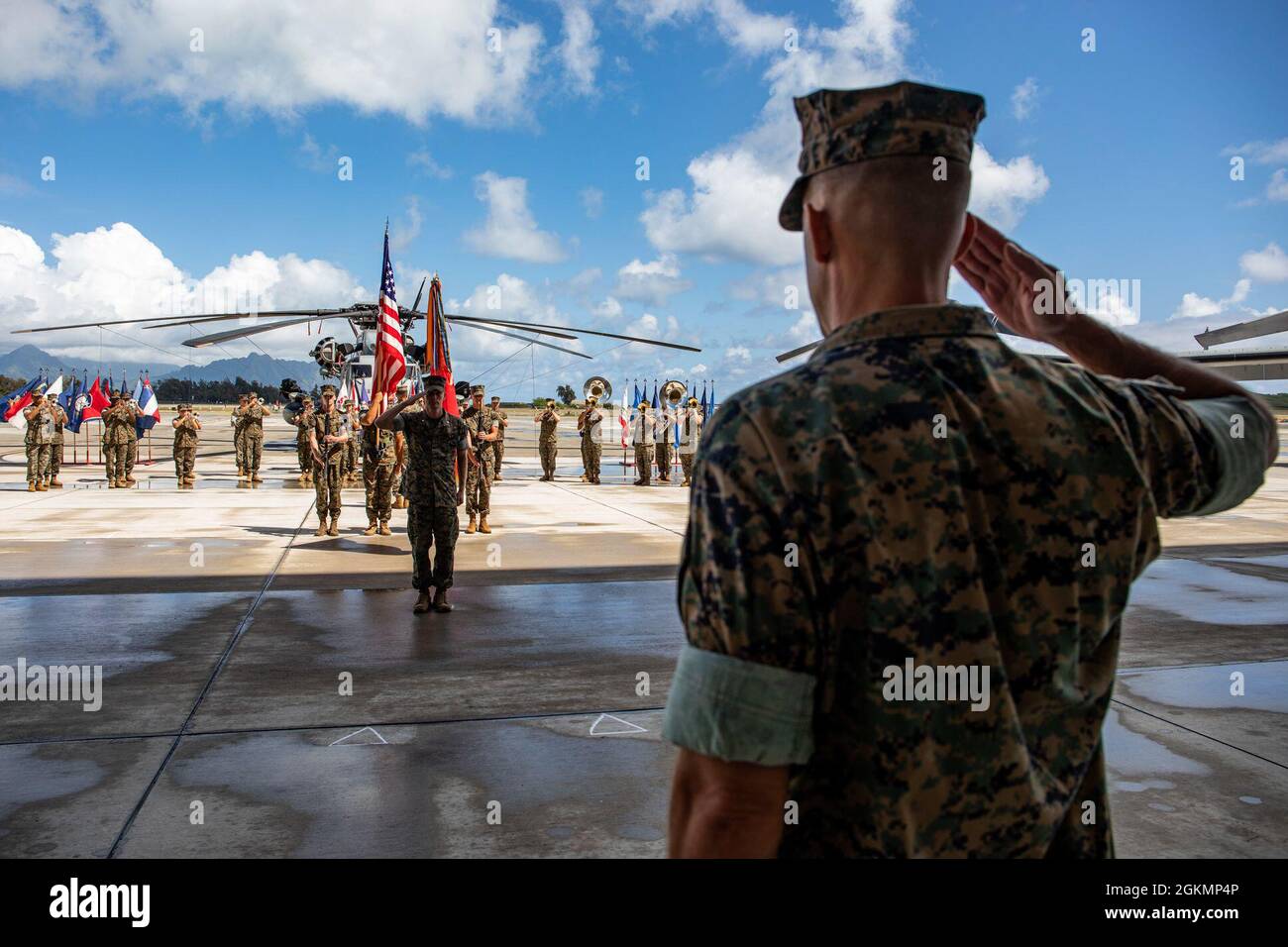 U.S. Marine Corps Lt. Col. Jaret R. Rhinehart salutes Col. Brian T ...