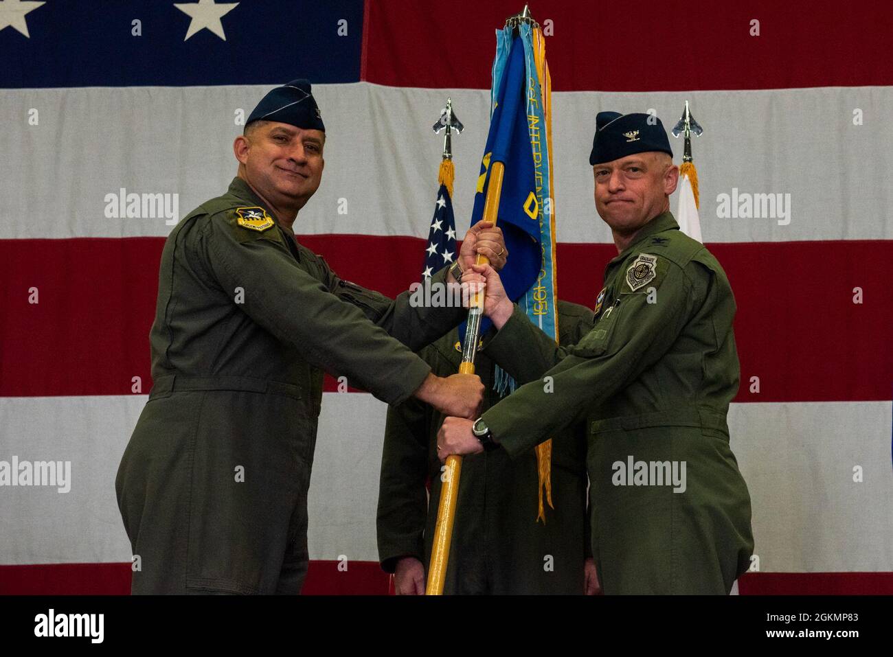 Col. John Gonzales, 51st Fighter Wing commander, left, presents the ...