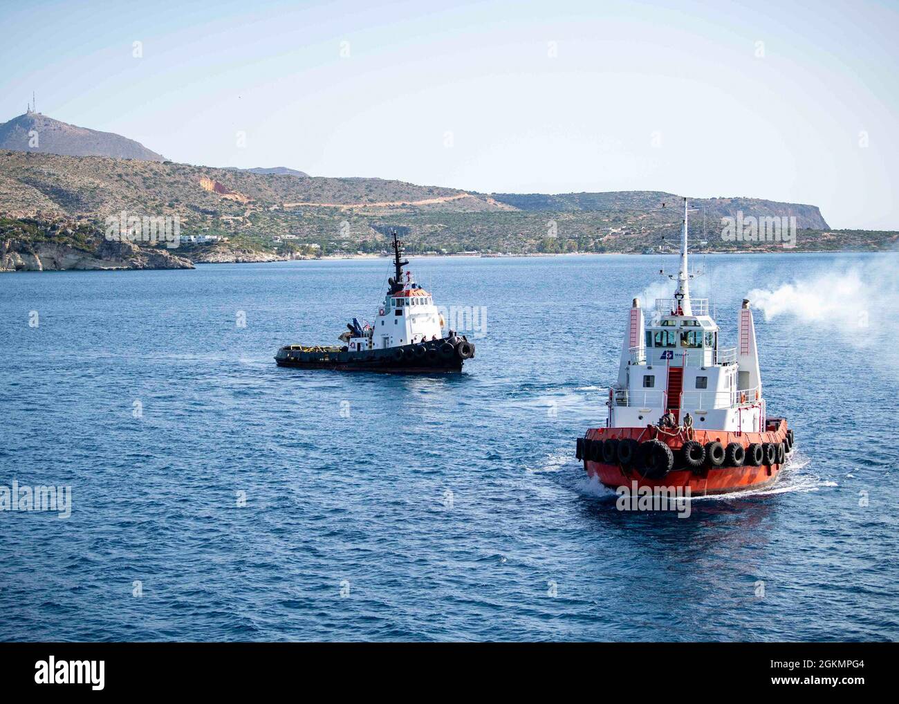 210528-N-NQ285-1062 SOUDA BAY, Greece (May 28, 2021) Tug boats prepare ...