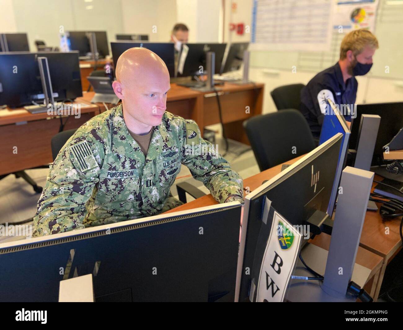 Lt. Noah Furgerson monitors a screen in the Joint Operations Center at ...