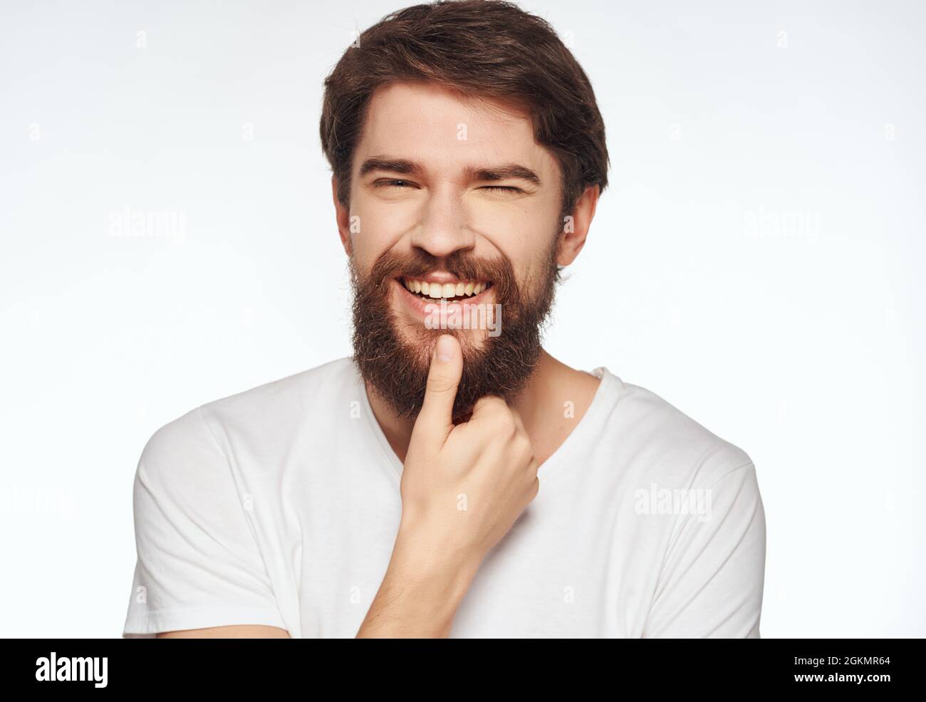 emotional man in a white t-shirt irritated facial expression close-up ...