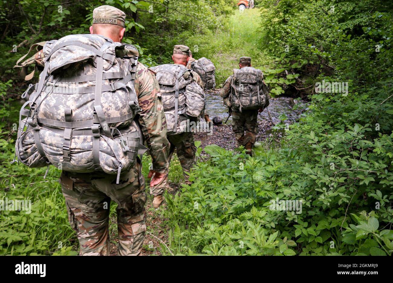 Iowa Army National Guard Soldiers cross a river while completing a Spur ...