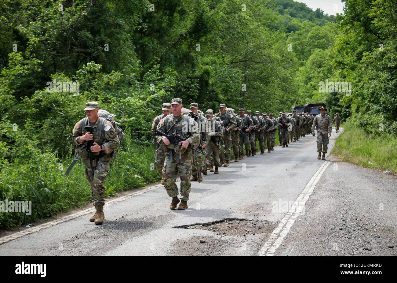 Iowa Army National Guard Soldiers set off on a ruck march during a Spur ...