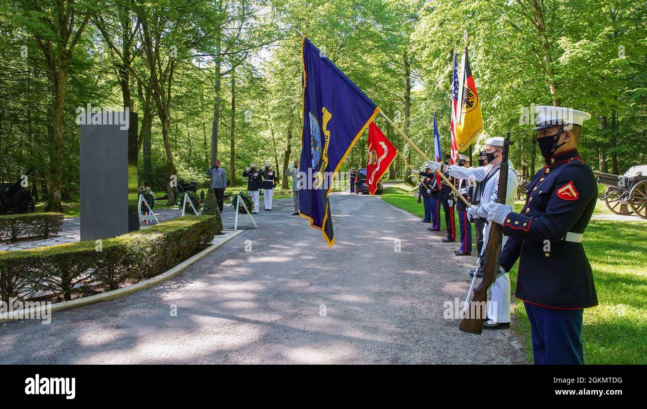A joint color guard presents the colors during the U.S. National Anthem ...