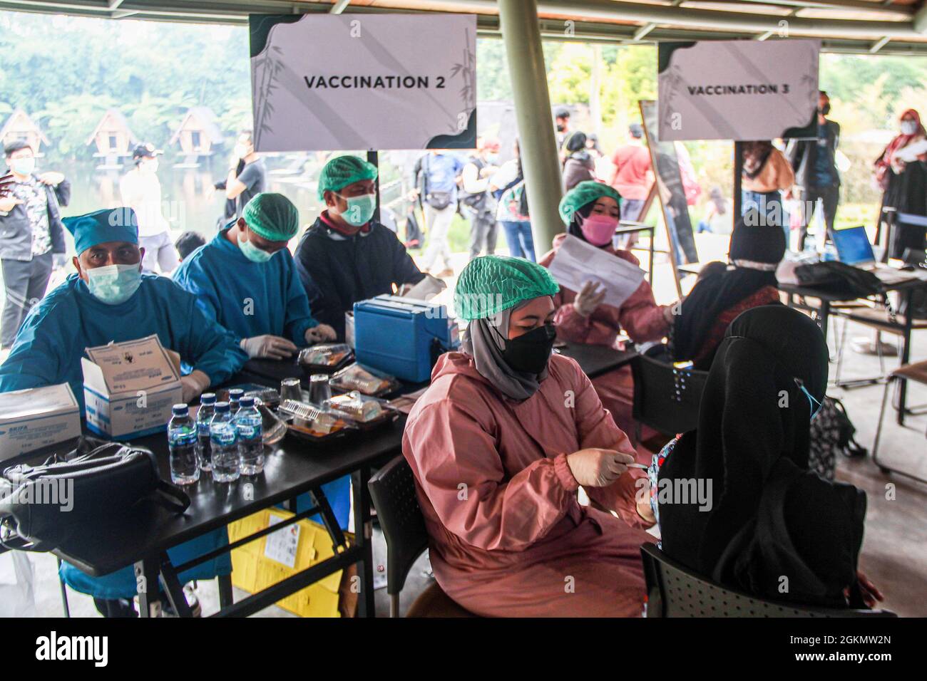 Dusun Bambu, Indonesia. 15th Sep, 2021. A health worker administers a ...