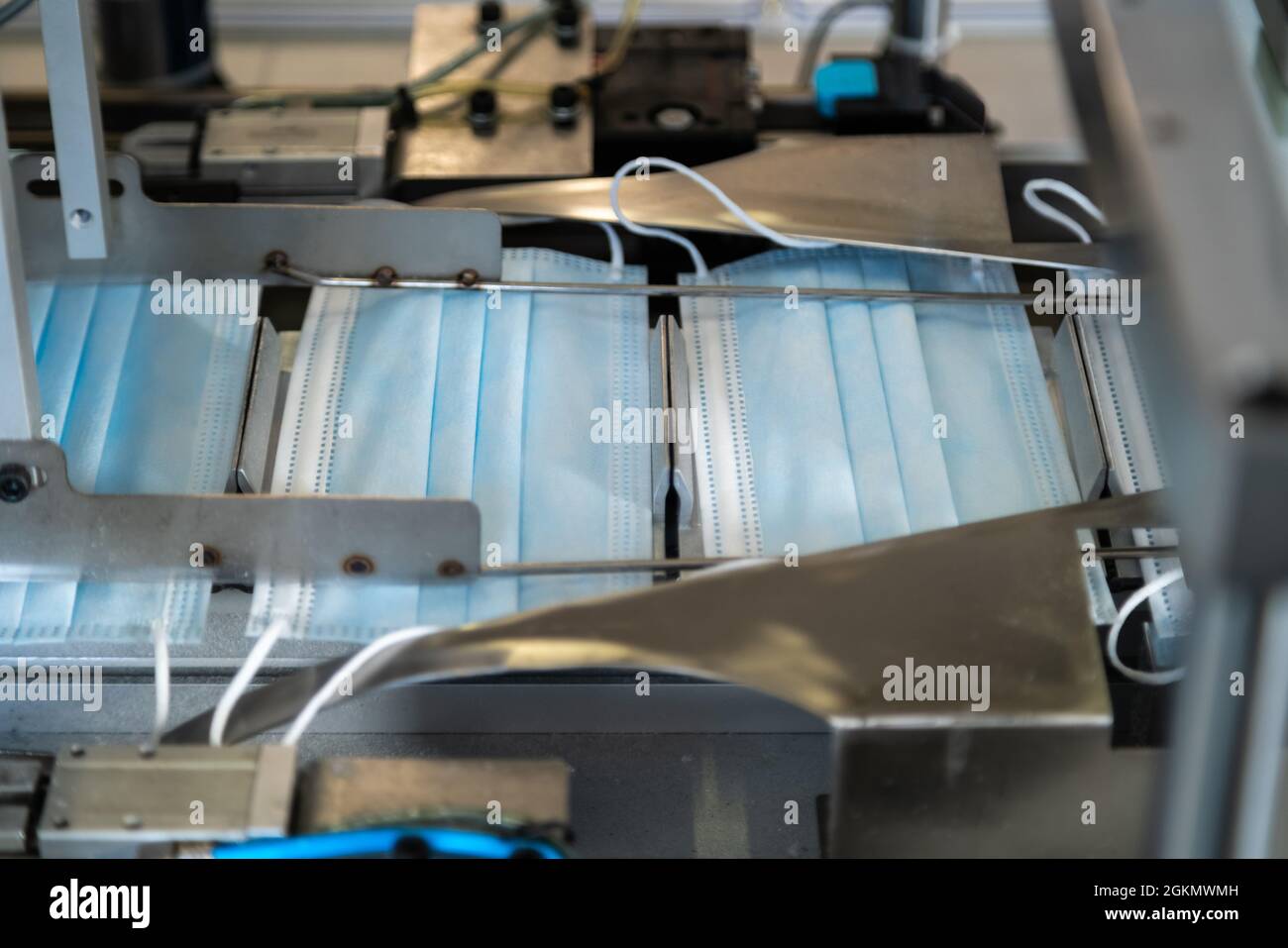 Closeup process of medical face masks being made in a factory ...