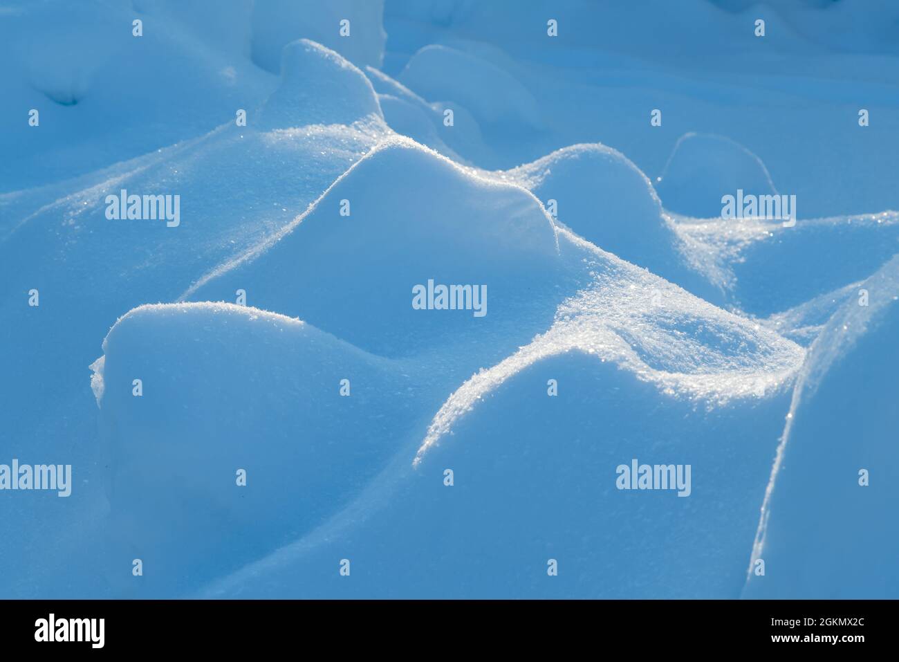 Fresh snow on the side of the sidewalk. Winter weather background ...