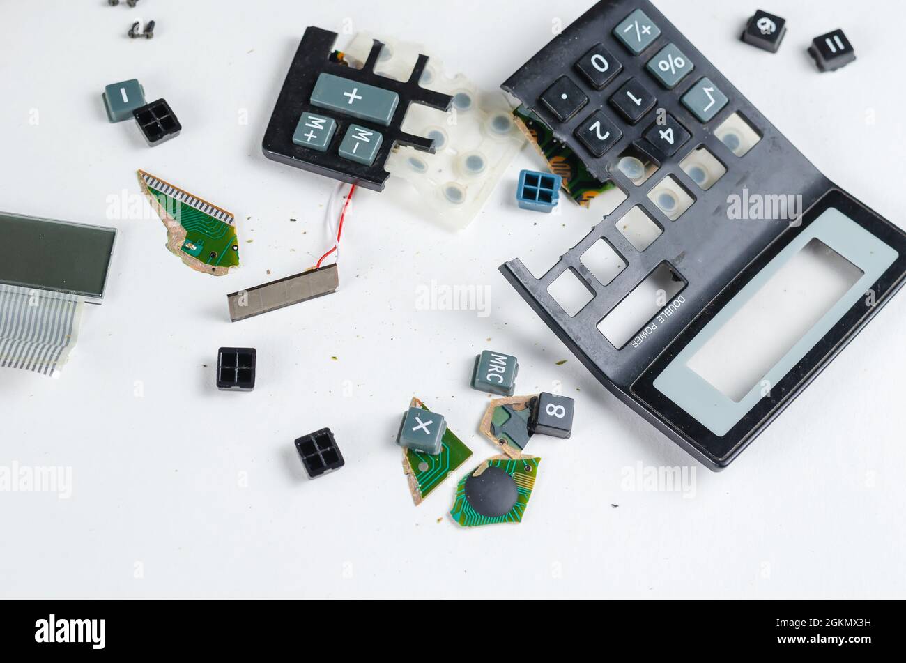 A shattered calculator on a white background. Buttons, pieces of Stock ...