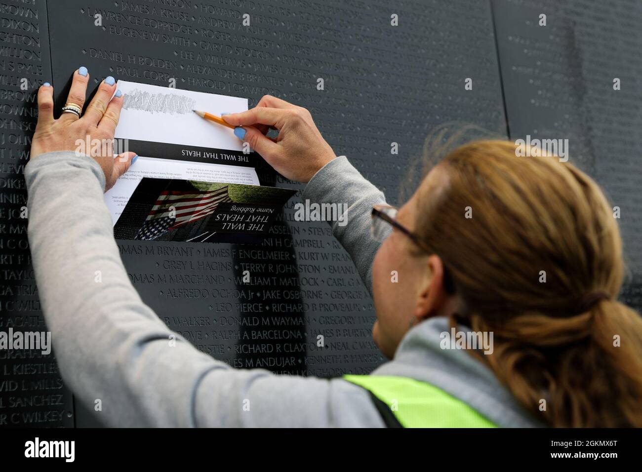 Ellen Lyons, a Team Red, White and Blue event volunteer, makes a ...