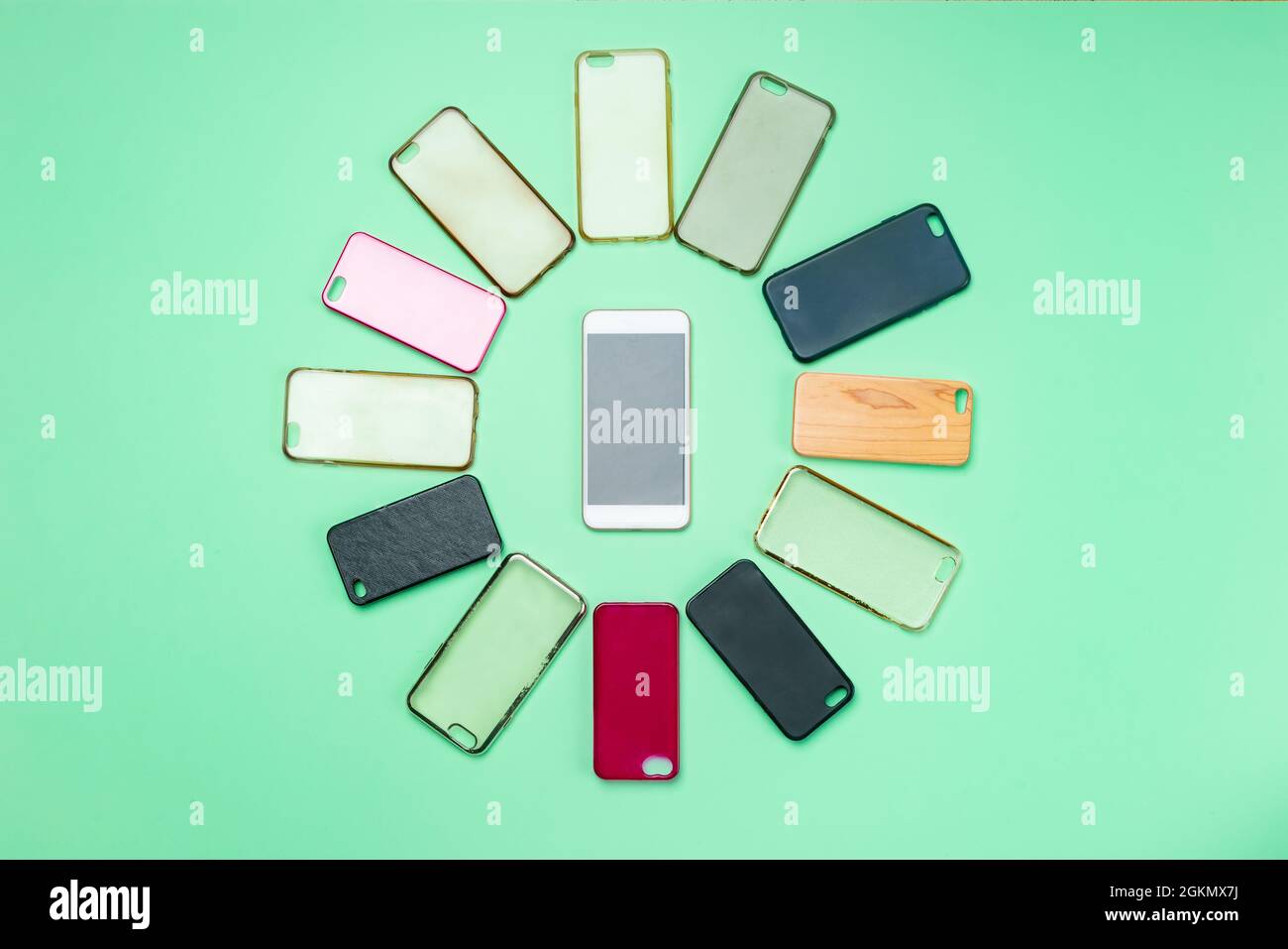 Choice of multicolored plastic back covers for mobile phones on green ...