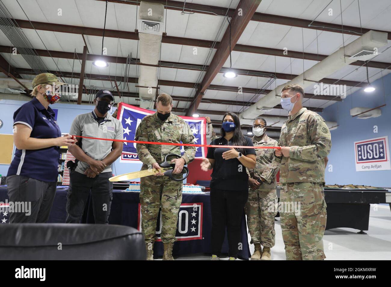 Rebecca Medieros, third from right, director of USO Kuwait, speaks to ...