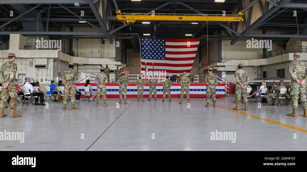 Airmen stand in formation while Col. Jeremy Fields, 319th Operations ...