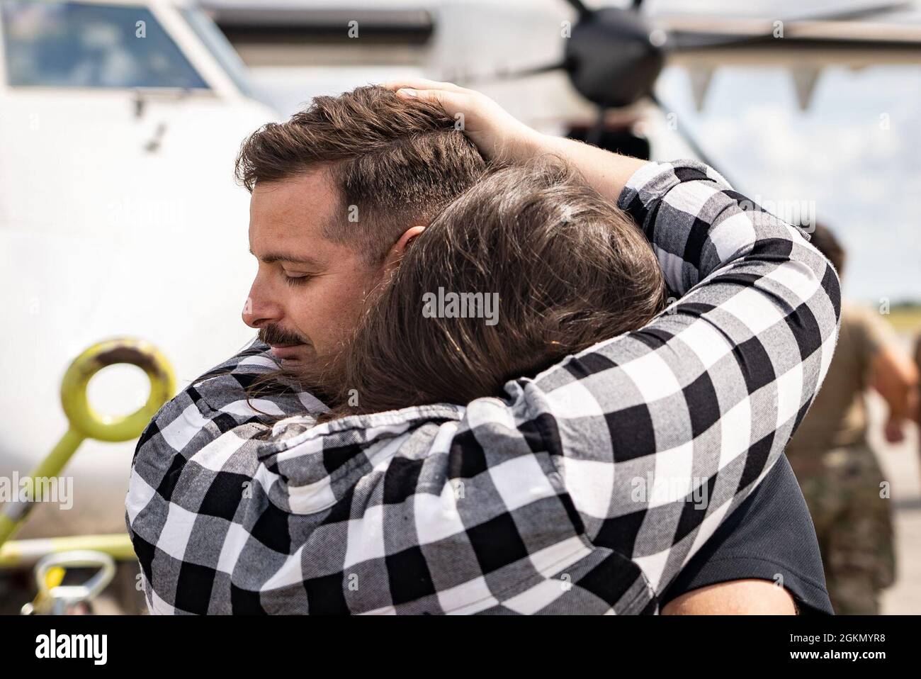 A Citizen Air Commando hugs a loved one after returning from a ...