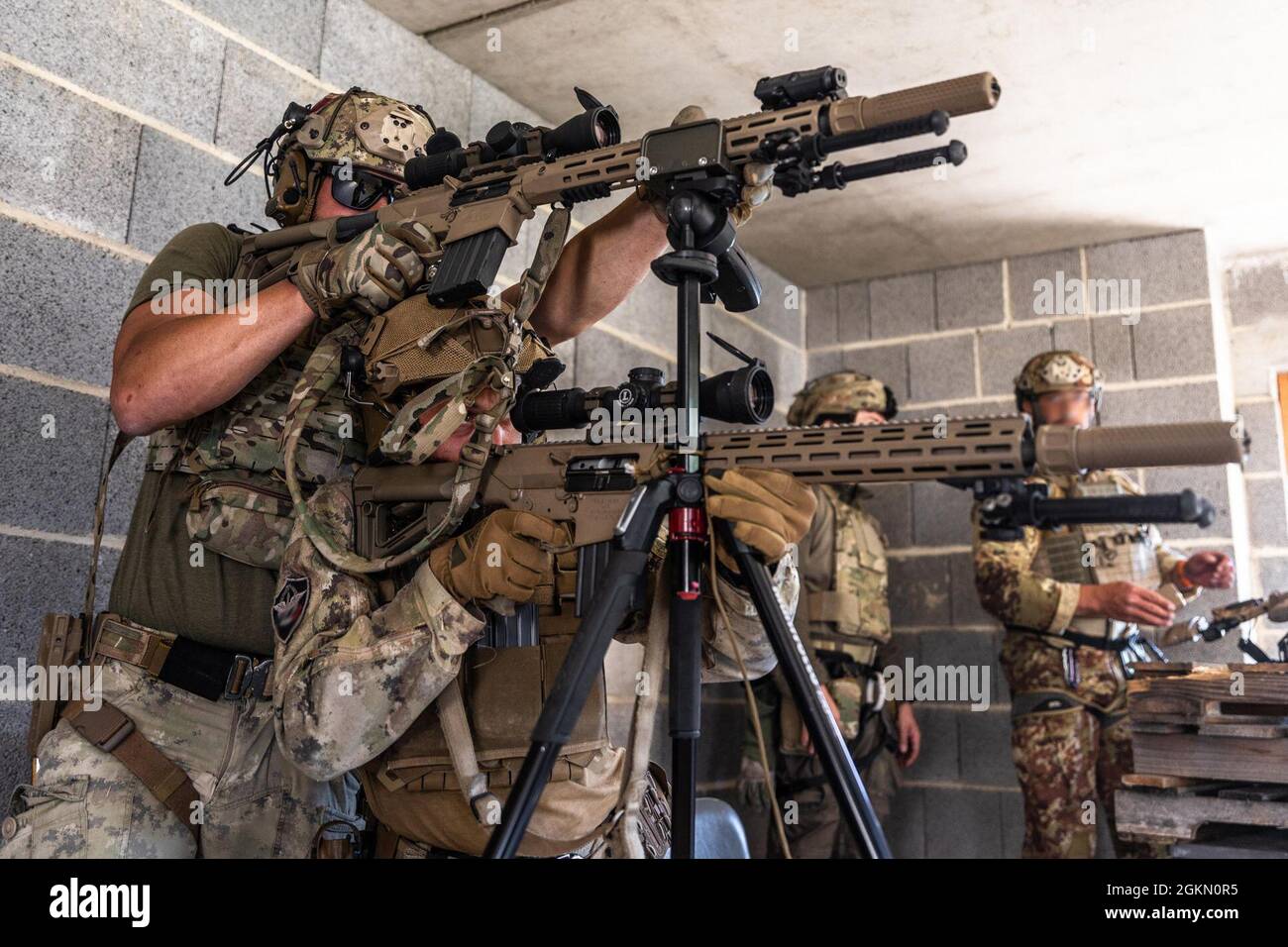 An Italian Special Forces sniper team engages two targets ...