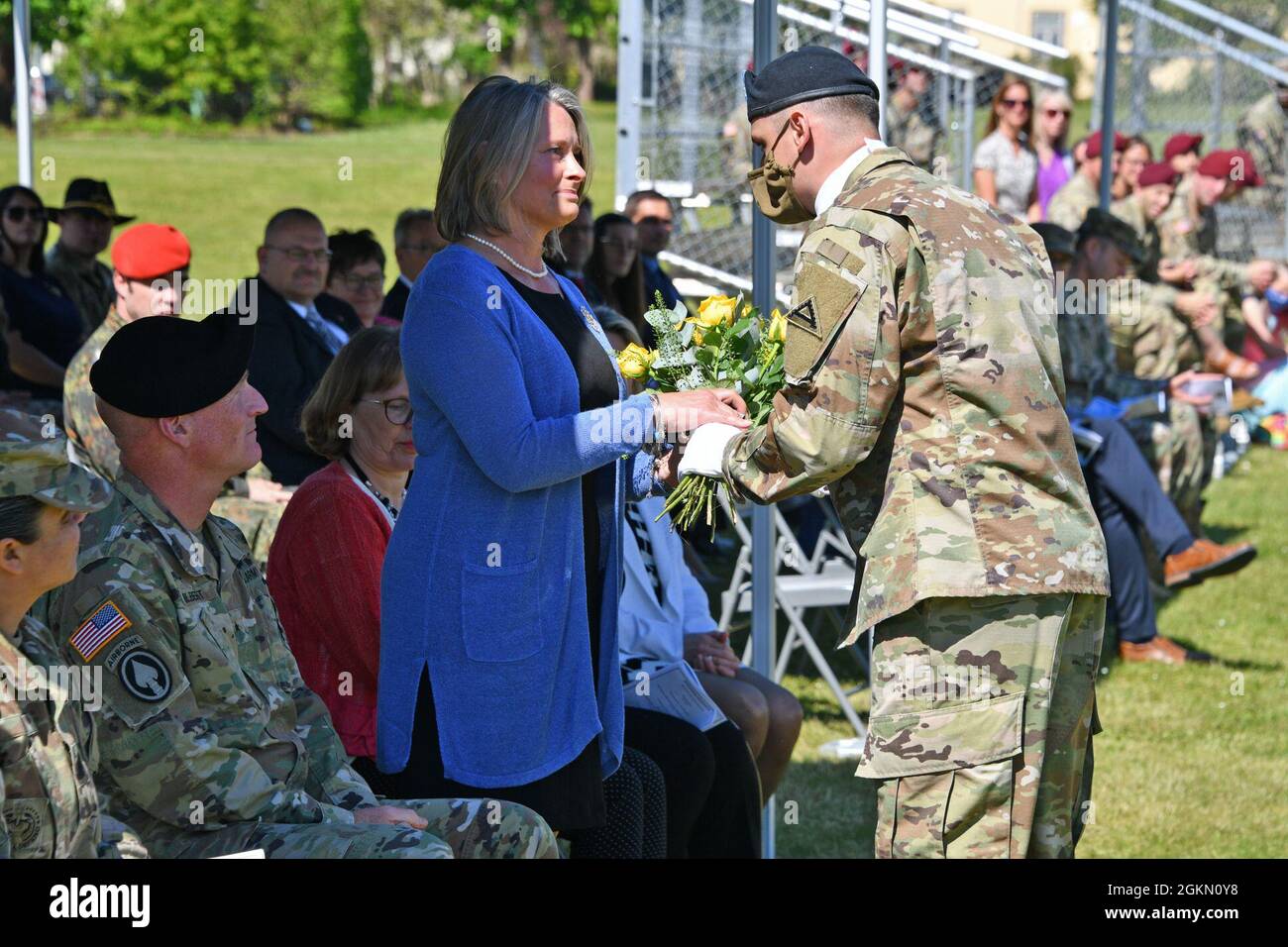 Left to right standing, Mrs. Beth Hilbert receives a bouquet with ...