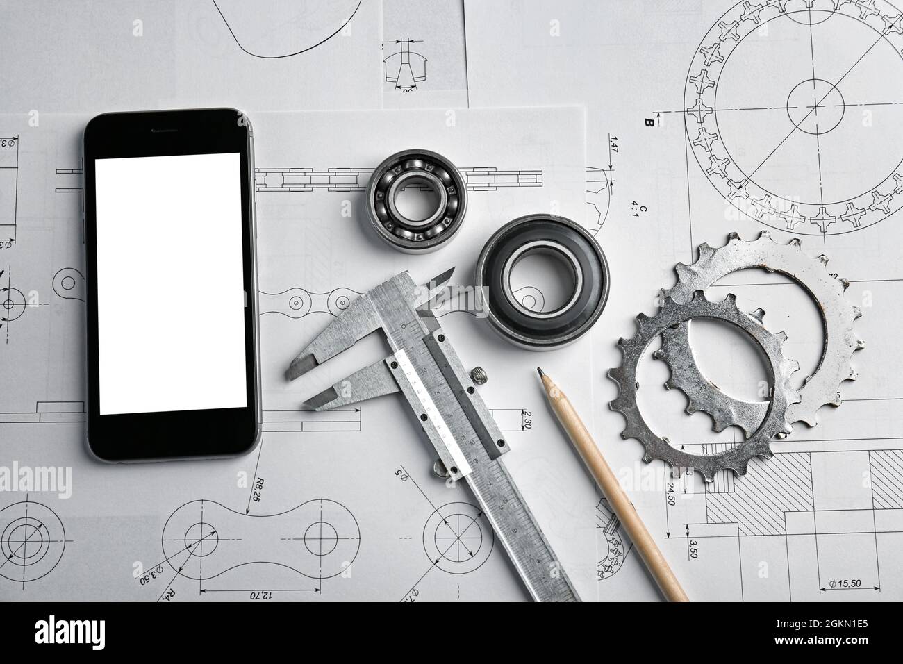 Engineering supplies, phone and blueprints on workplace Stock Photo - Alamy