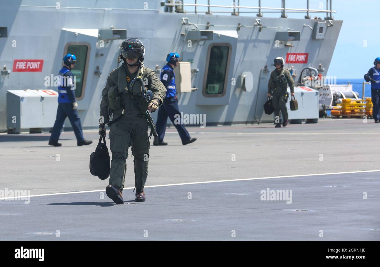 A Marine with Marine Fighter Attack Squadron 211, CSG-21, walks across ...