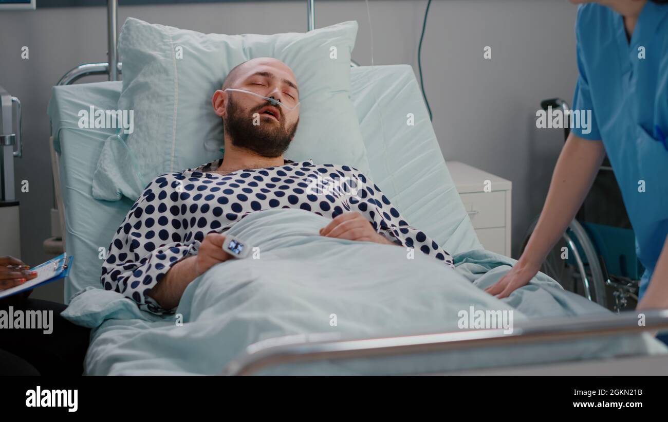 Medical nurse checking temperature monitoring sickness symptom during ...