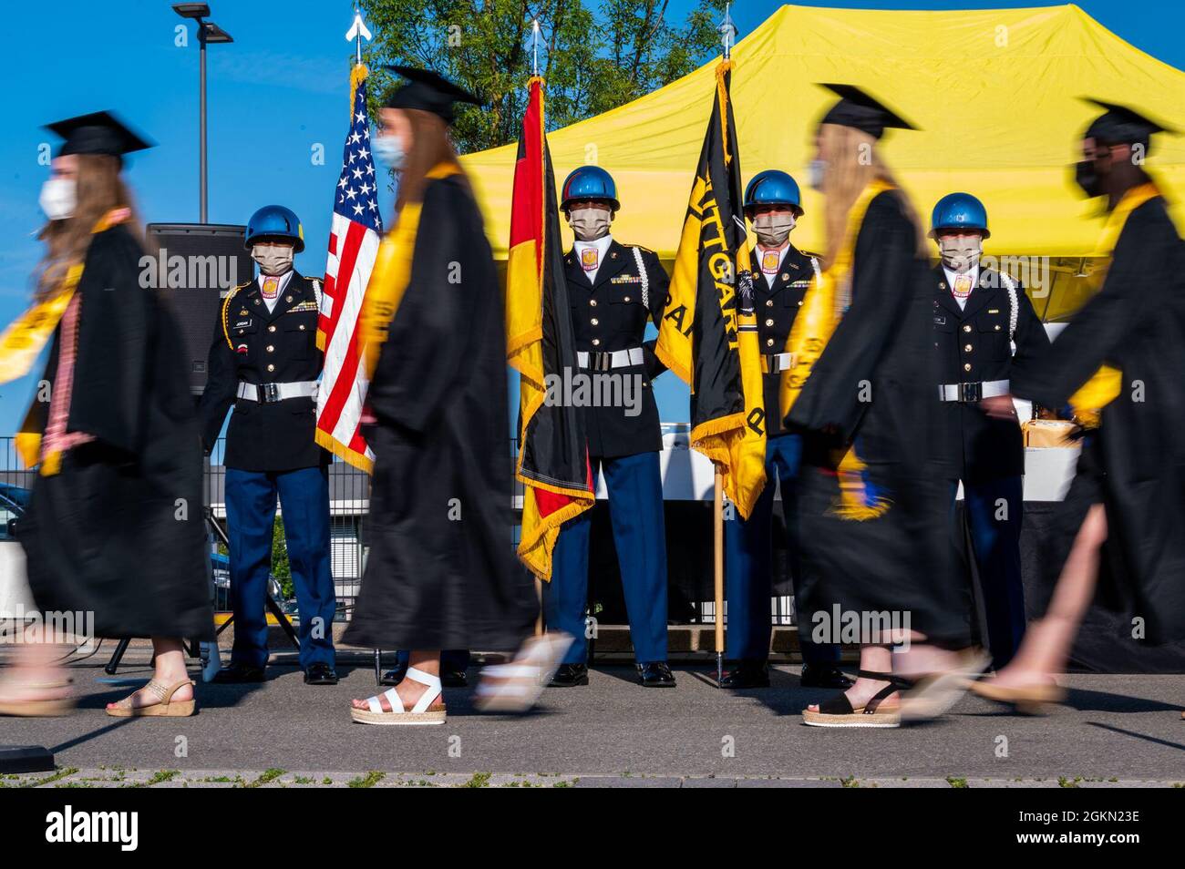 Stuttgart High School graduates walk toward the graduation stage during ...