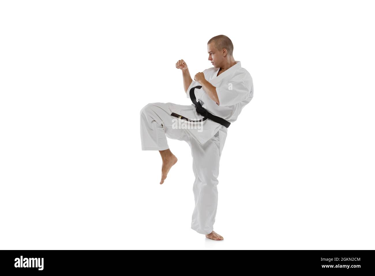 Side view. One caucasian sportsman standing in a fight pose isolated ...