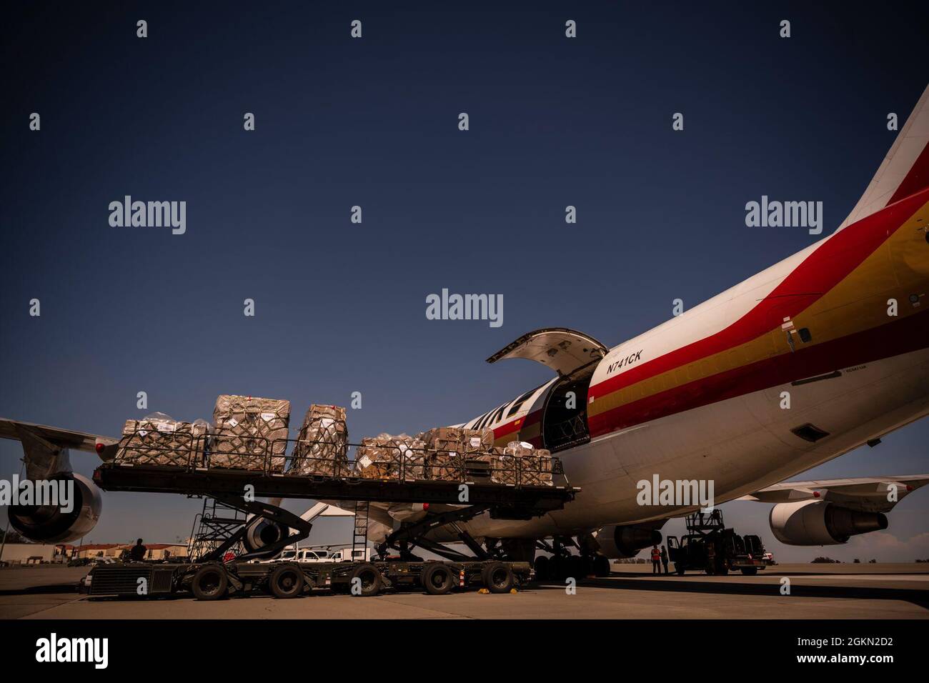 Airmen from the 60th Aerial Port Squadron load pallets onto a Kalitta ...