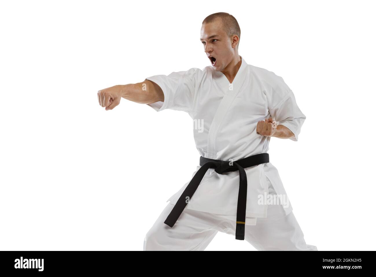 Side view portrait of one caucasian sportsman in kimono with black belt ...