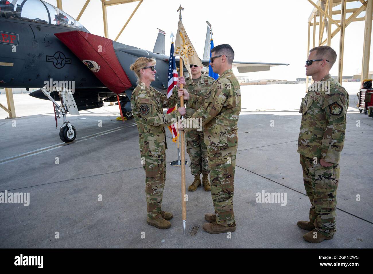U.S. Air Force Lt. Col. John Pohlen (right), outgoing 380th ...